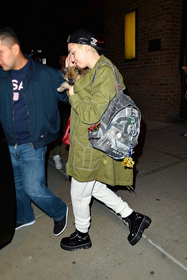 Miley Cyrus Carries The Infamous Chanel Graffiti Backpack | PurseBlog